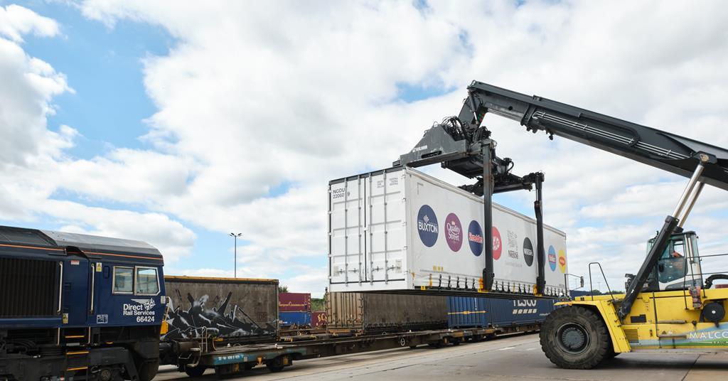 Raising-roof container designed to get supermarket goods onto rail ...